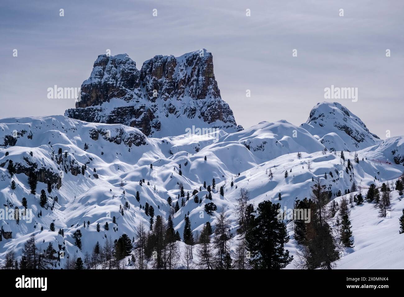 Snow-covered slopes of alpine Dolomite landscape around Falzarego pass ...