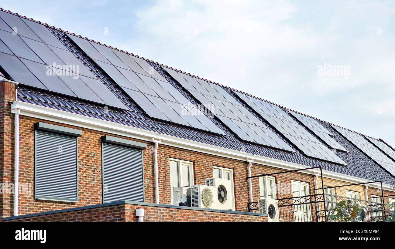 air source heat pump unit installed outdoors at a modern home with ...