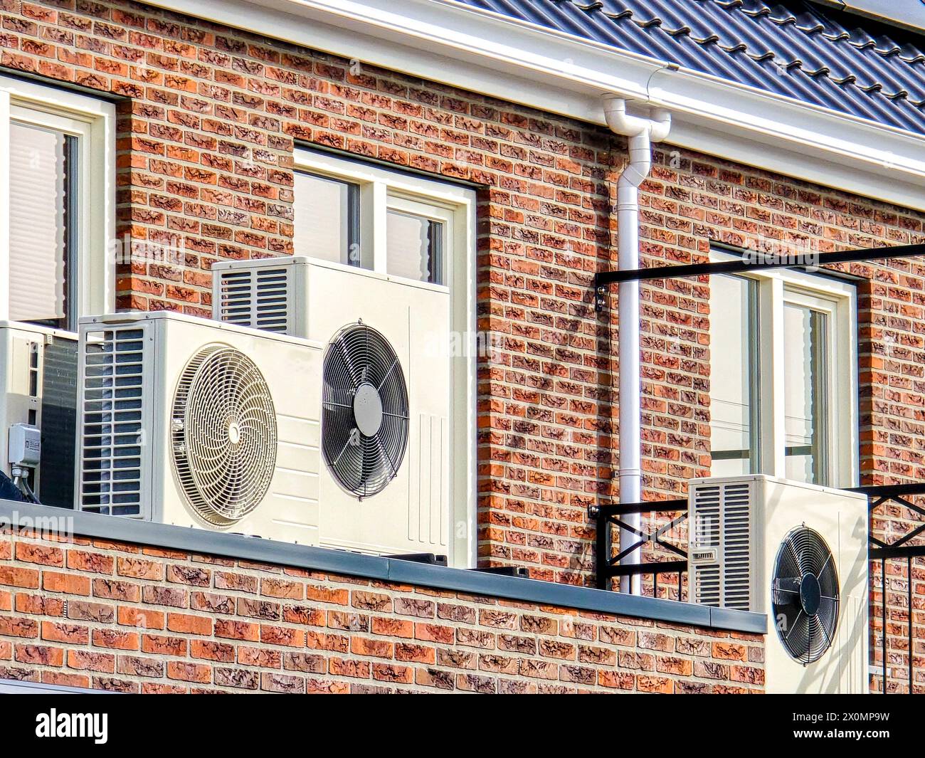 close up of an air source heat pump unit installed outdoors at a modern ...