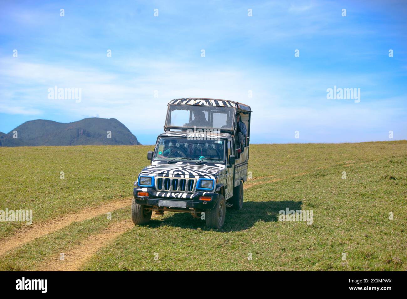 Safari jeep in Blue sky and view point of Moon Plains Sri Lanka Nuwara ...