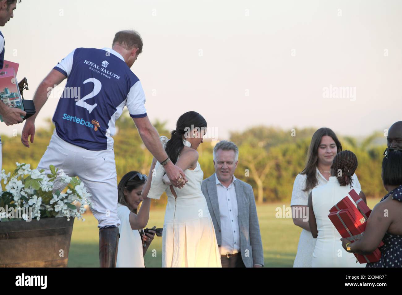 The Duke and Duchess of Sussex after his team the Royal Salute Sentebale Team defeated the Grand ...