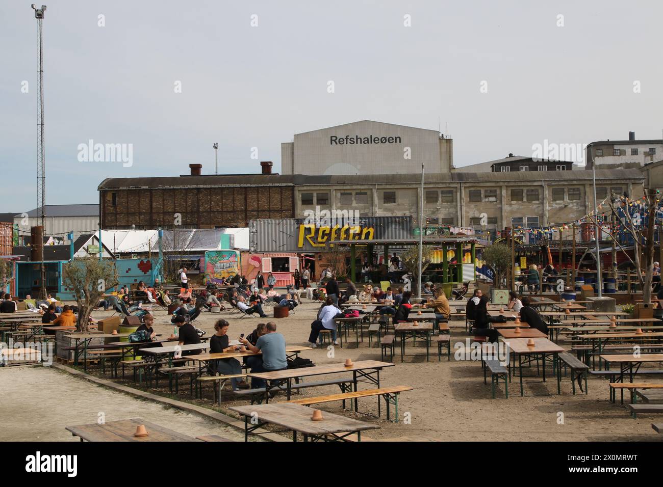 People sitting on sun loungers and at tables Refen Copenhagen Denmark ...