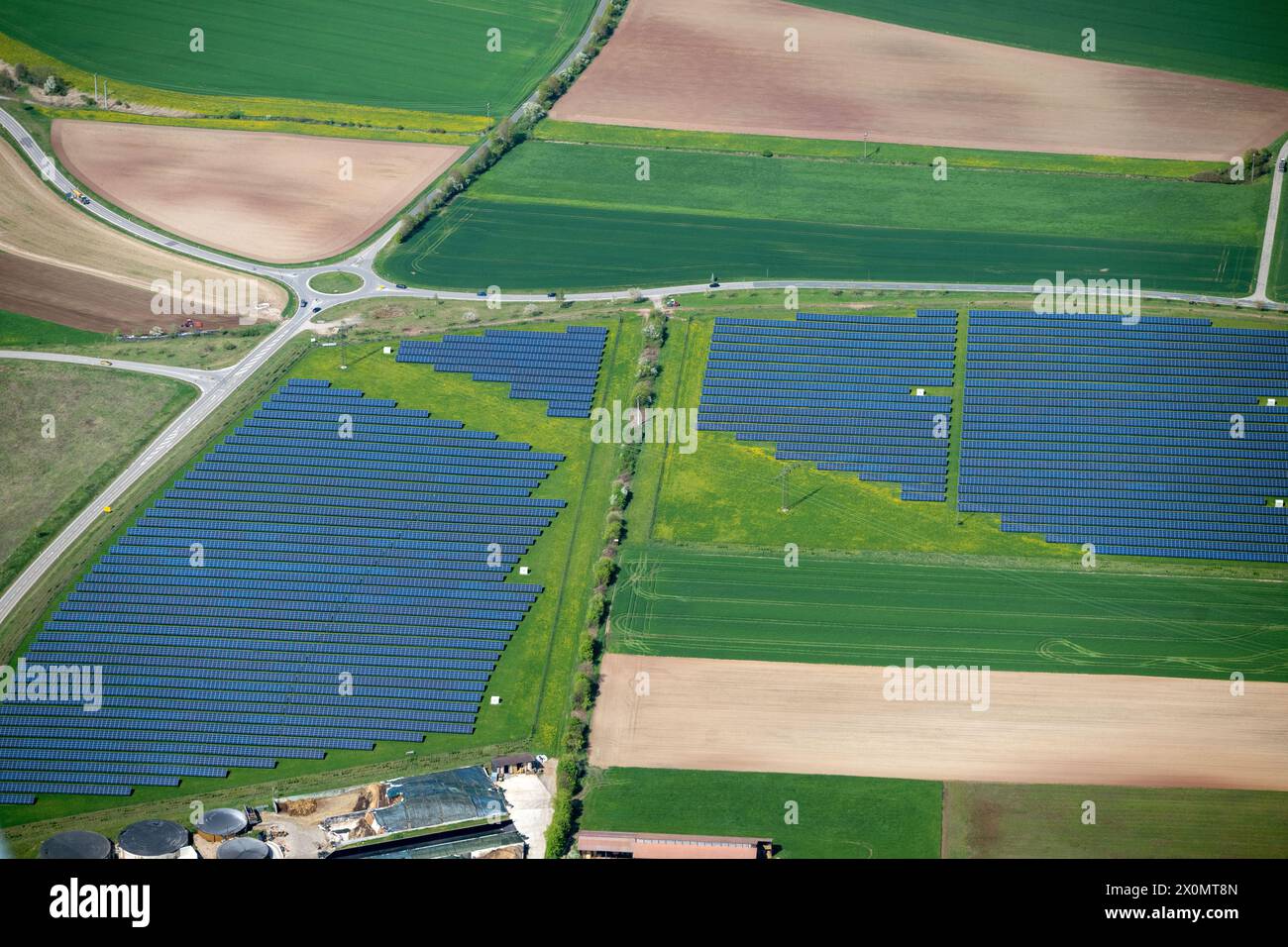 Ansbach, Germany. 12th Apr, 2024. Ground-mounted photovoltaic modules ...