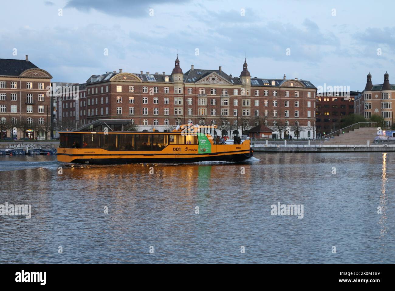 Yellow boat bus at dusk in Copenhagen Harbour Denmark April 2024 Stock ...