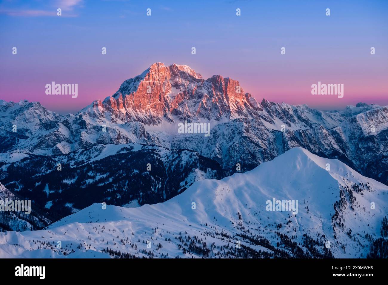 The snow-covered summit of Monte Civetta, surrounded by alpine Dolomite ...