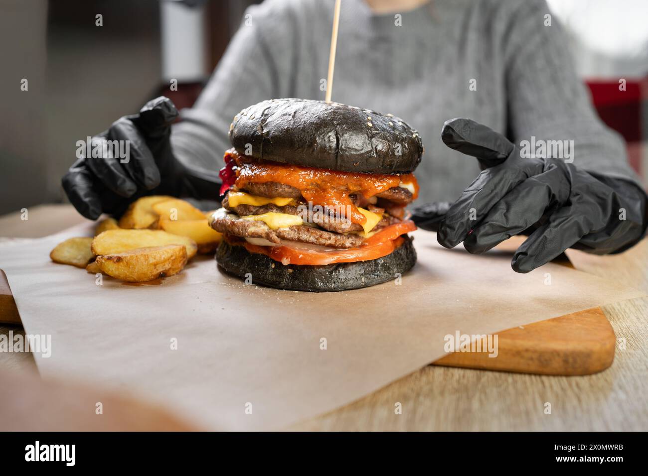 Black woman eat burger barbeque hi-res stock photography and images - Alamy