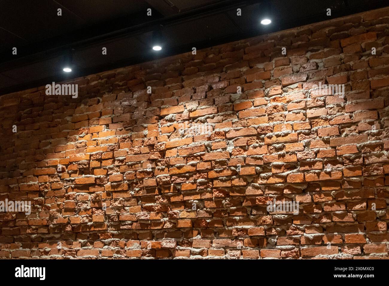 Brick wall with spotlight from the ceiling, highlight its texture Stock ...