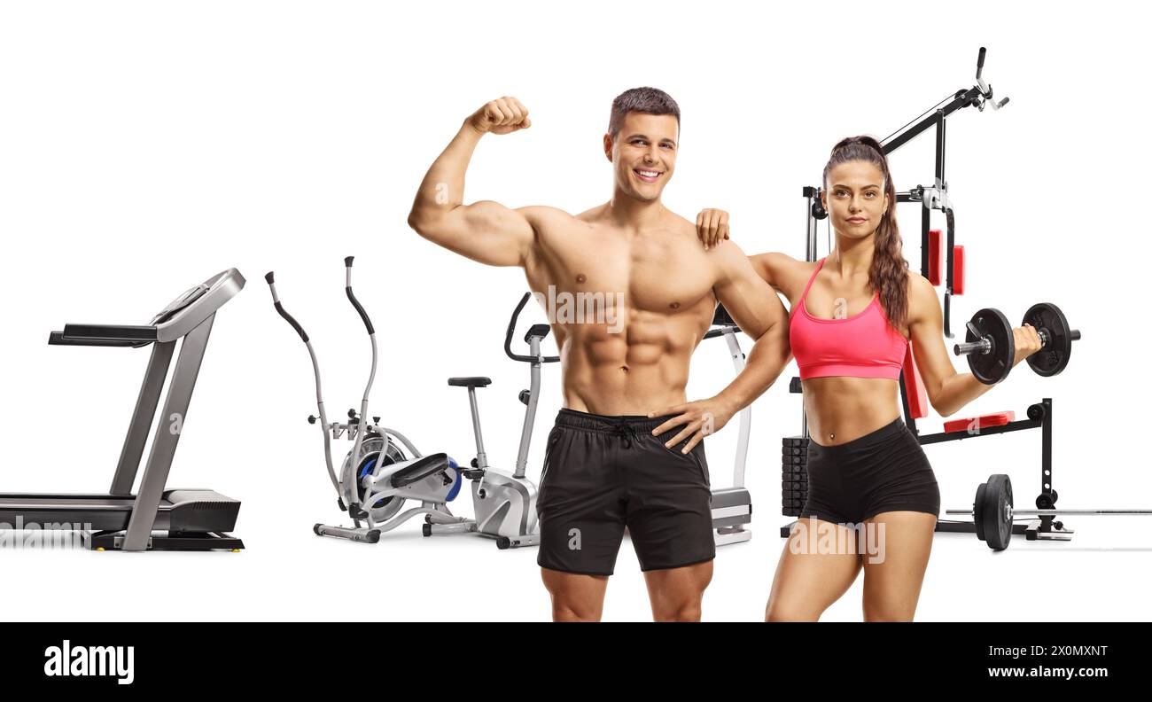 Fit man and woman with exercise machines and fitness equipment isolated ...