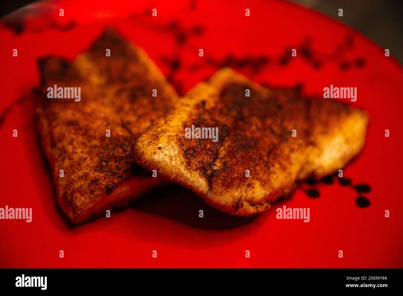 Cajun blackened filet of Mahi Mahi Stock Photo - Alamy