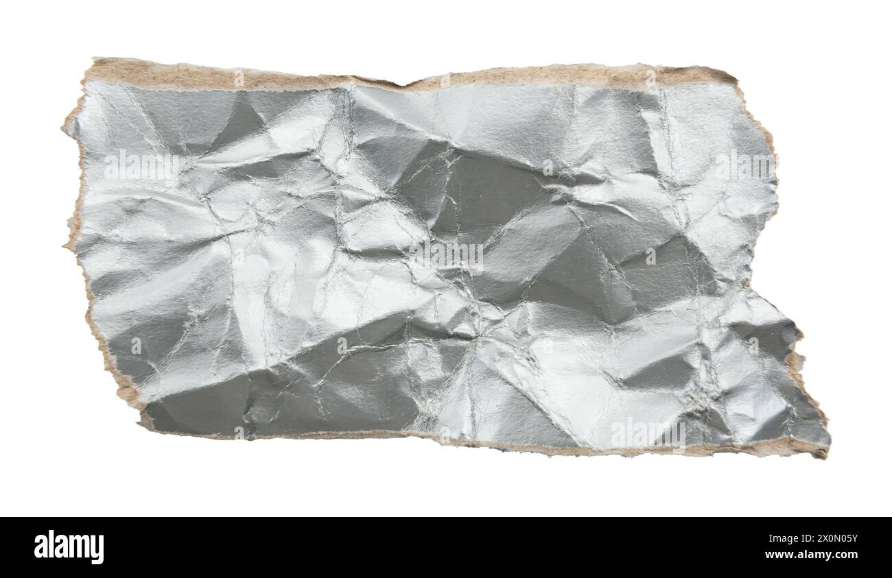 A piece of crumpled silver paper with folds and wrinkles on a white ...