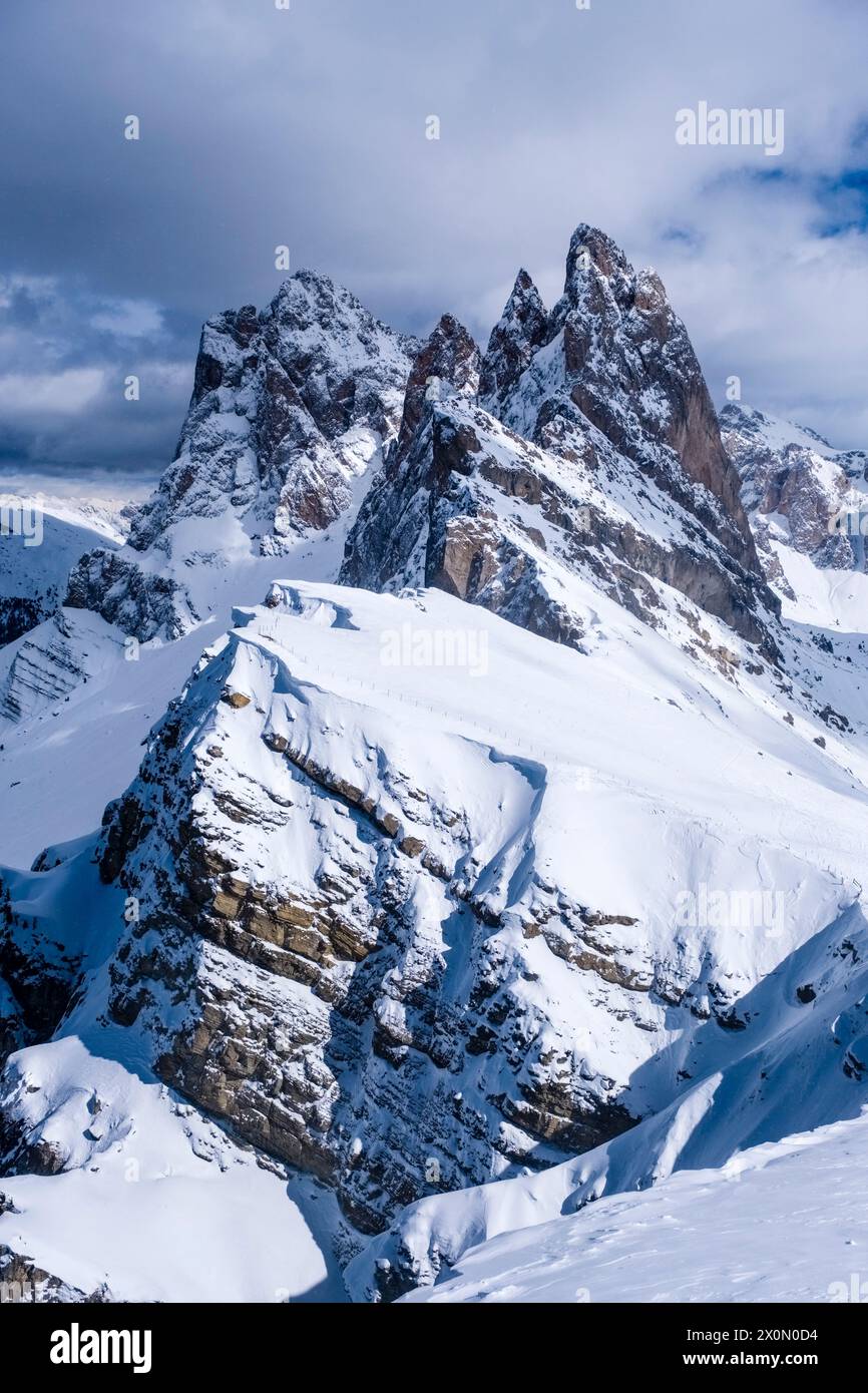 The snow-covered summits of the Odle group, surrounded by alpine ...