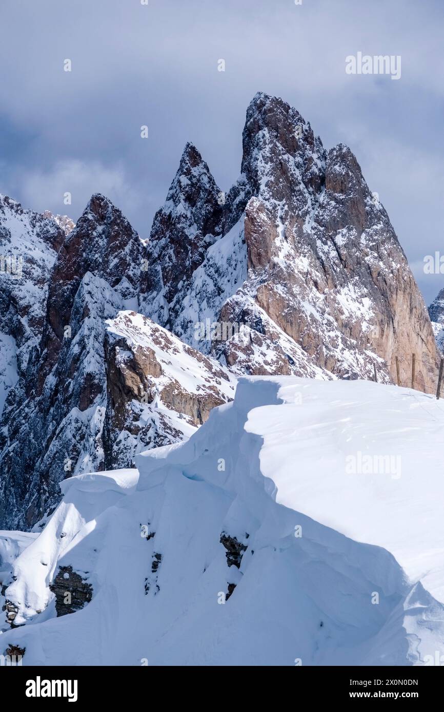 The snow-covered summits of the Odle group, surrounded by alpine ...