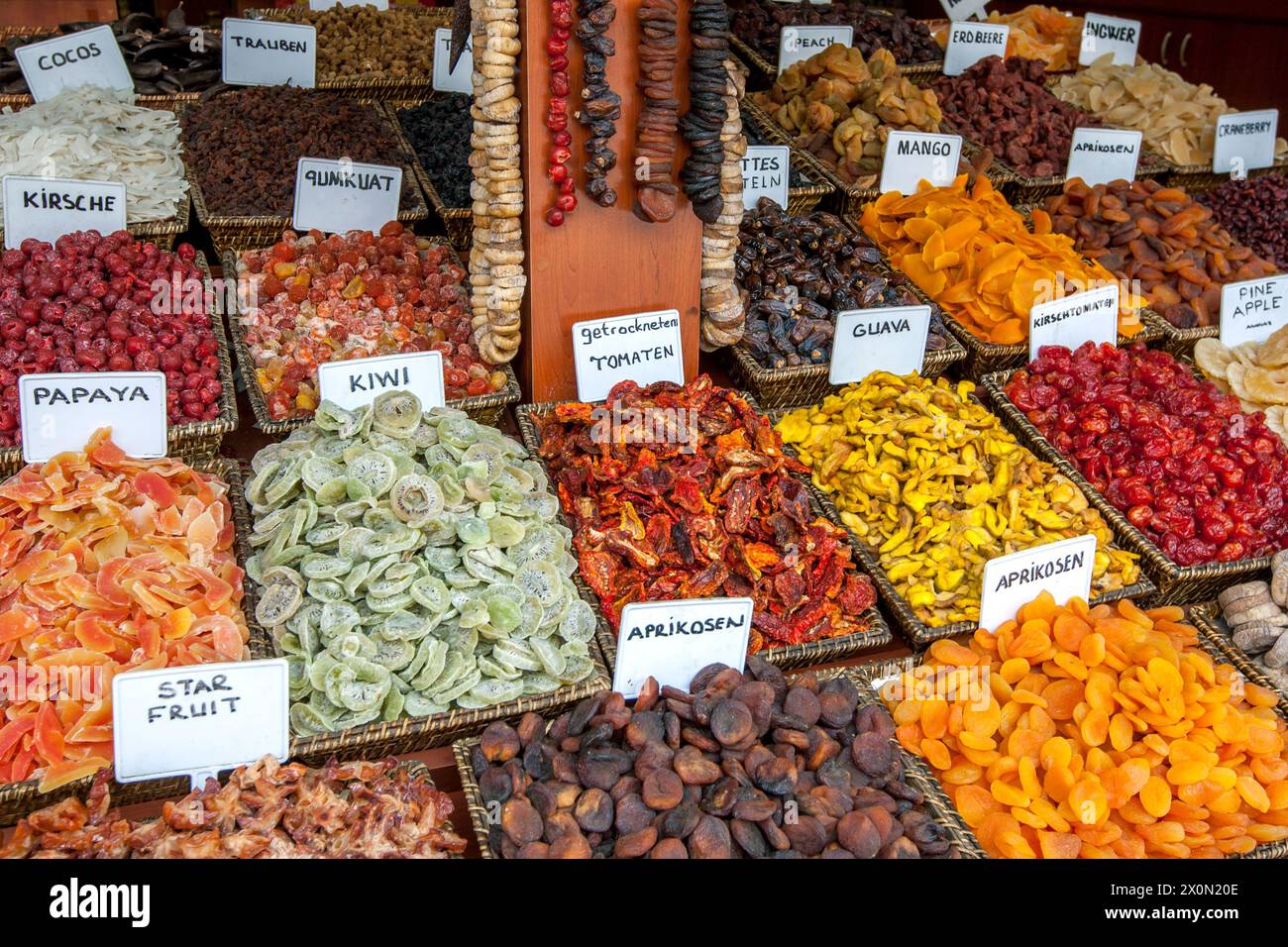 A variety of dried fruits, berries and vegetables for sale at a market ...
