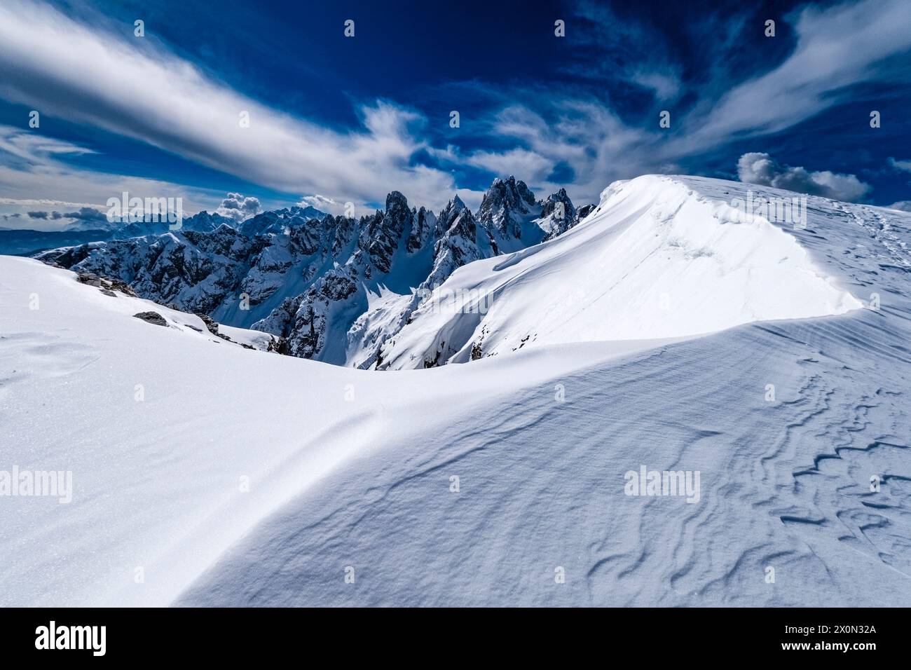 Snowdrift creating artful structures in Tre Cime Natural Park in winter ...