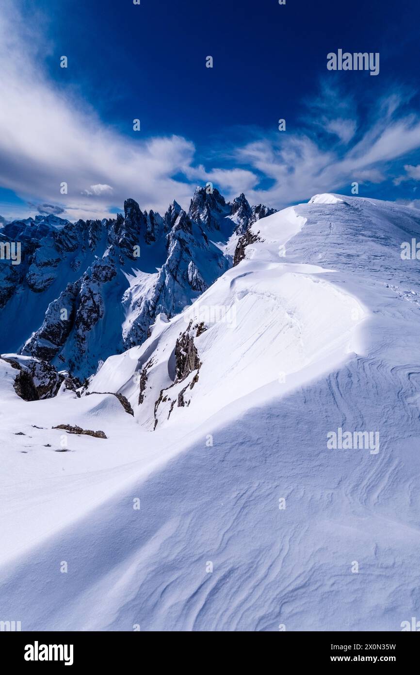 Snowdrift creating artful structures in Tre Cime Natural Park in winter ...
