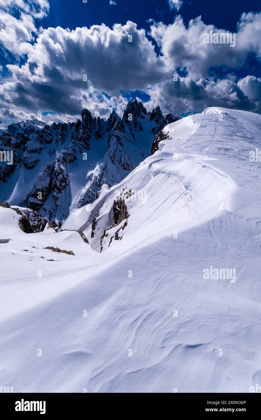 Snowdrift creating artful structures in Tre Cime Natural Park in winter ...