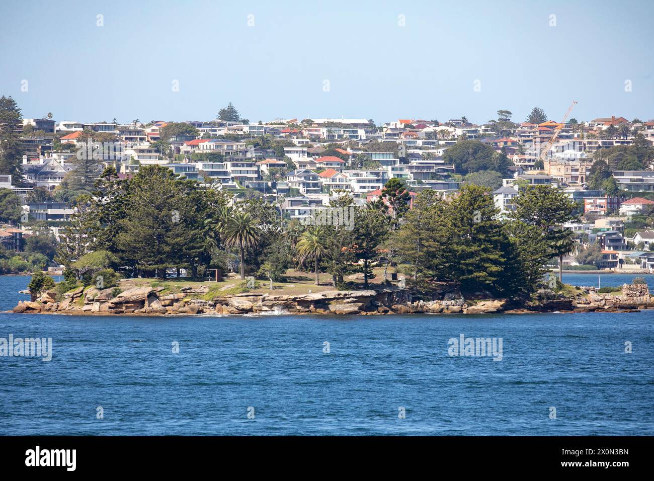 Shark Island in Sydney Harbour, with waterfront homes and houses in the ...