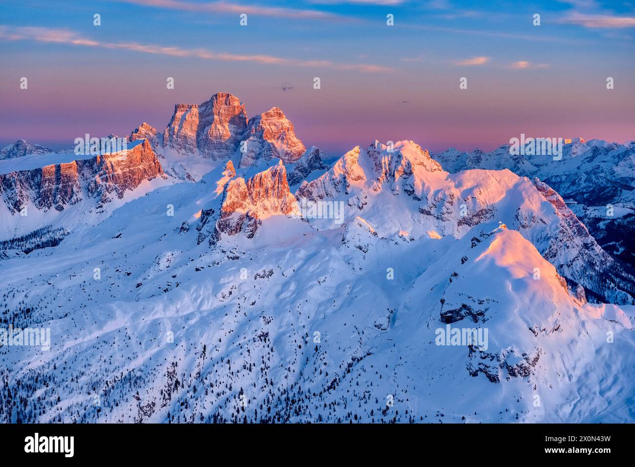 The snow-covered summit of Mt. Pelmo, surrounded by alpine Dolomite ...
