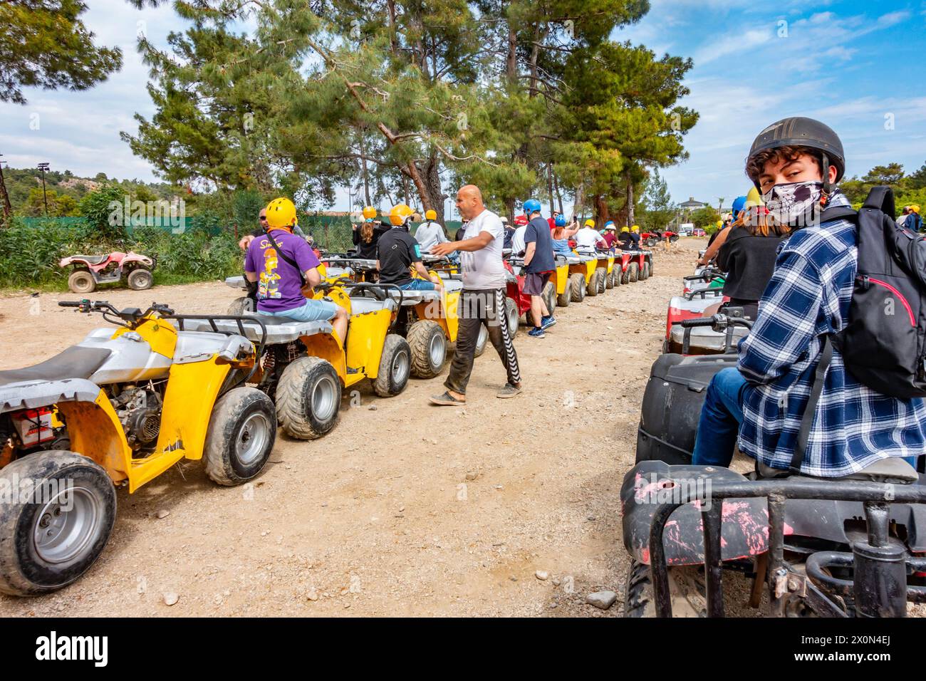 People riding quad bikes on an afternoon excursion on holiday in ...