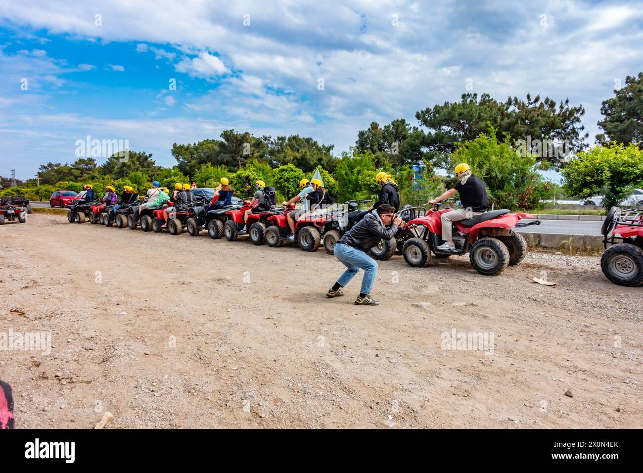 People riding quad bikes on an afternoon excursion on holiday in ...