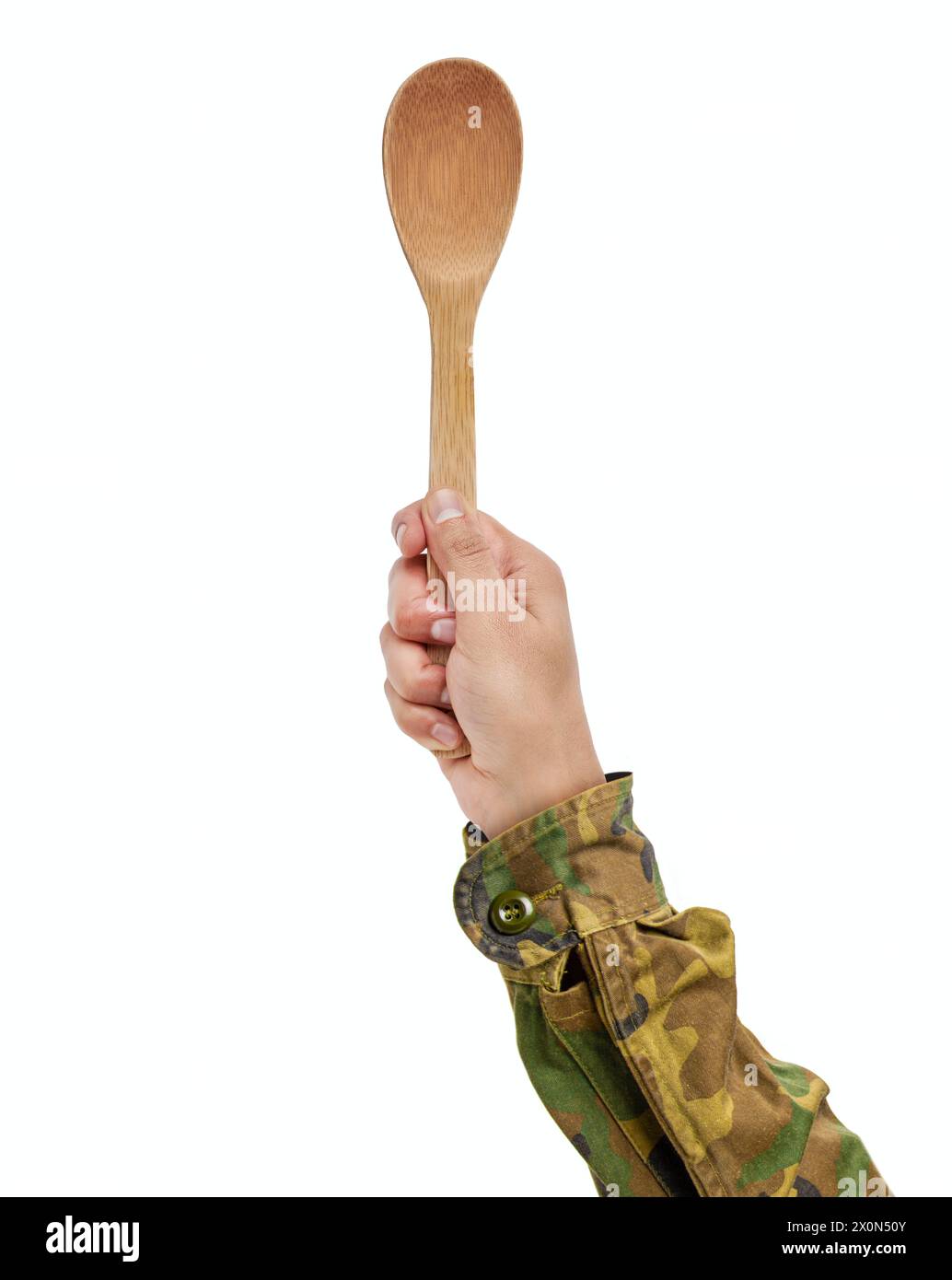 A chef arm holding wood spoon with white background Stock Photo - Alamy