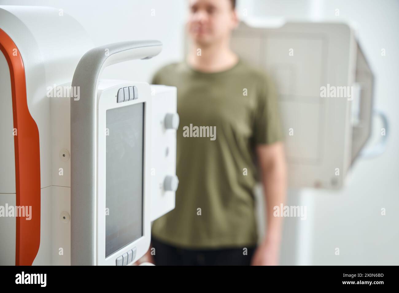 Patient undergoing shoulder radiography in anterior-posterior ...