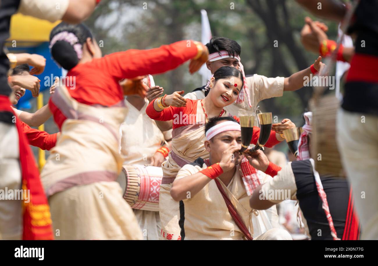 Young men and women in traditional attire performs Bihu dance, as they ...