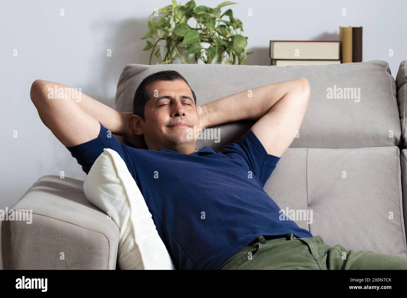 Man resting head on arms hi-res stock photography and images - Alamy