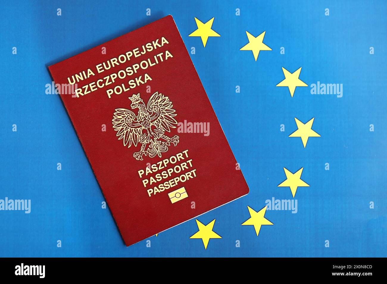 Poland passport of European Union on blue flag background close up ...