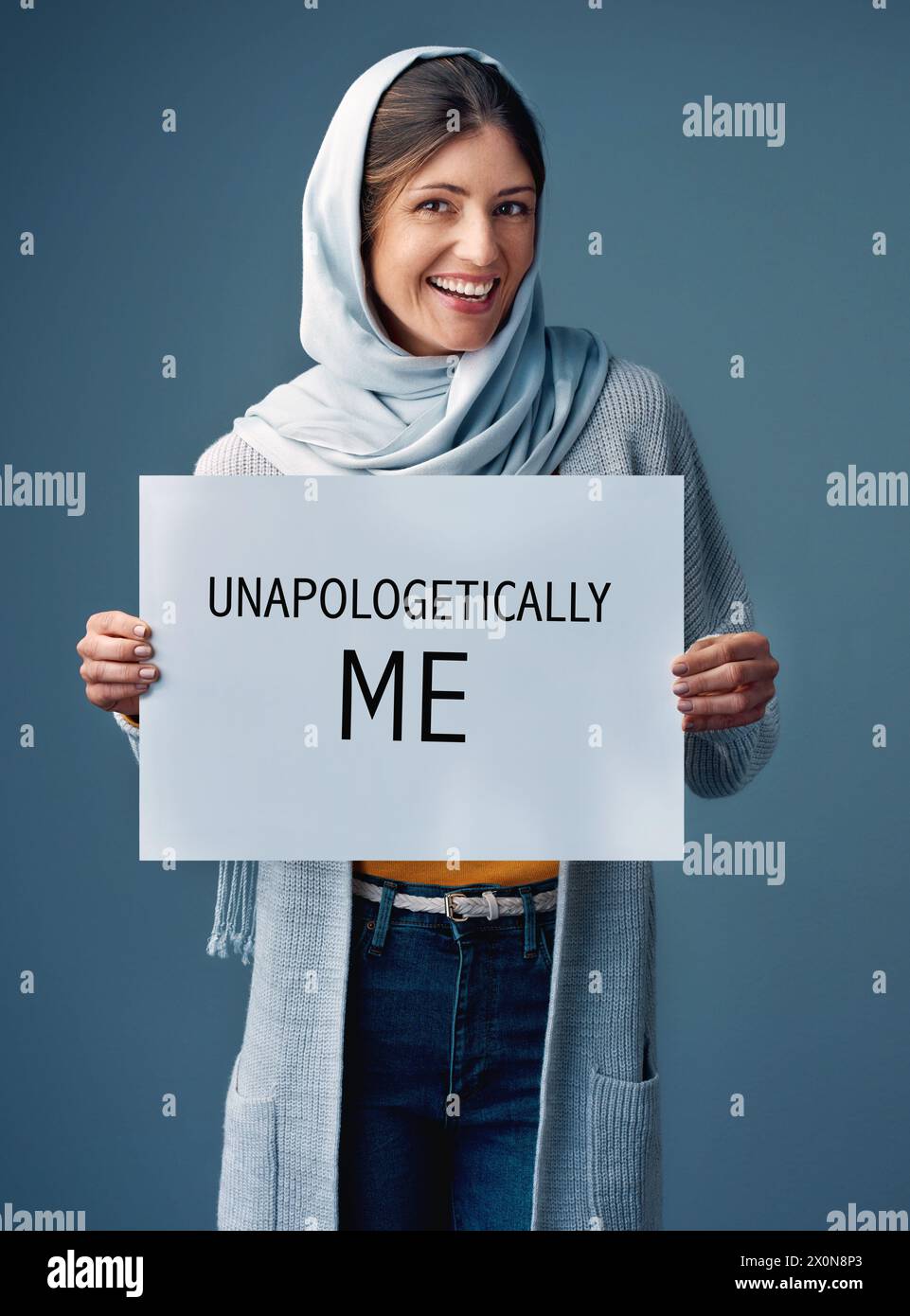 Muslim, woman and smile with poster in studio on blue background for ...