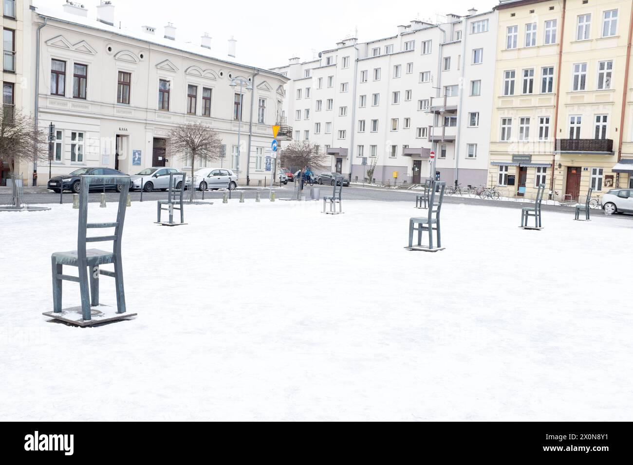 Empty chairs memorial in the snow on Jewish Heroes Square in Krakow ...