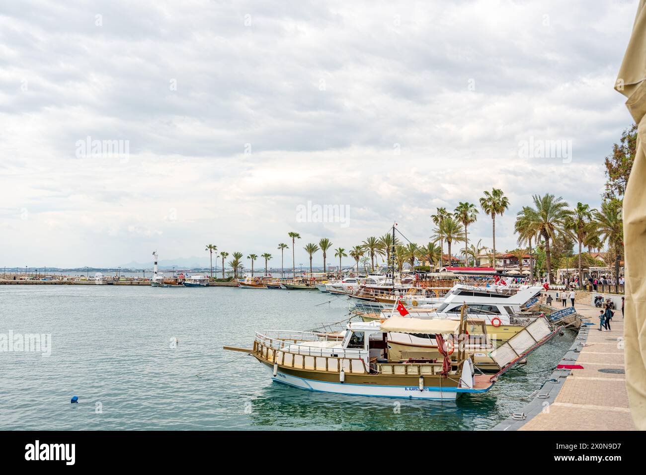 Side, Manavgat, Turkey – April 9, 2024: Sightseeing boats and town ...