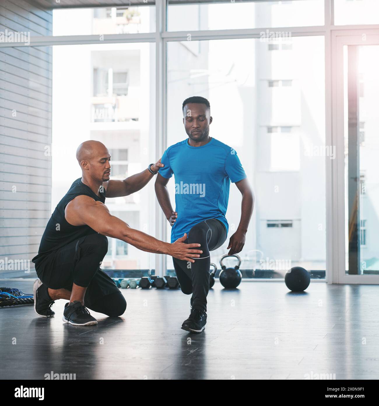 Fitness, instructor and lunge exercise in gym, diversity and people in ...