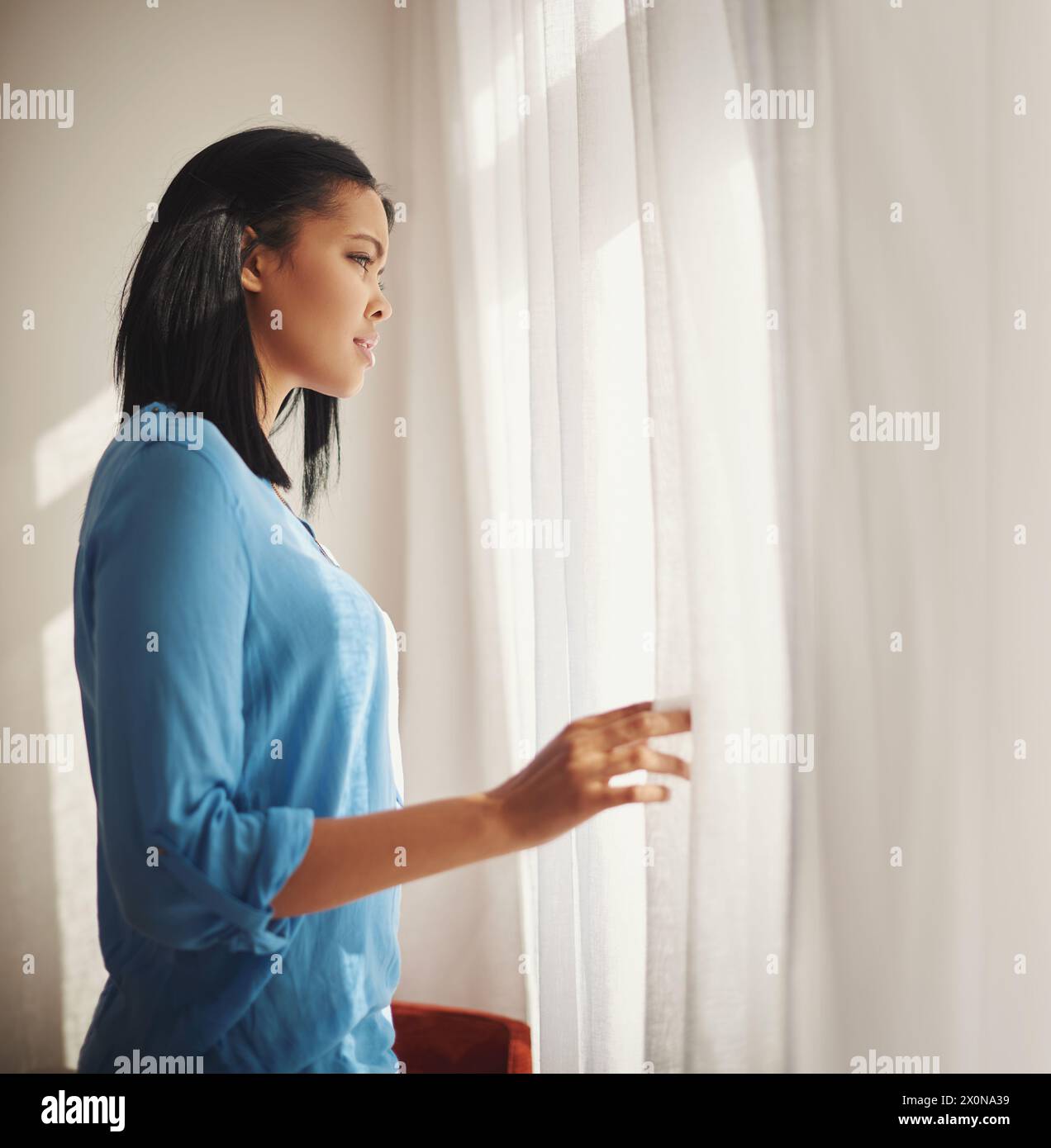 Stress, african woman, looking at living room window with anxiety, confused and worry. Curious ...