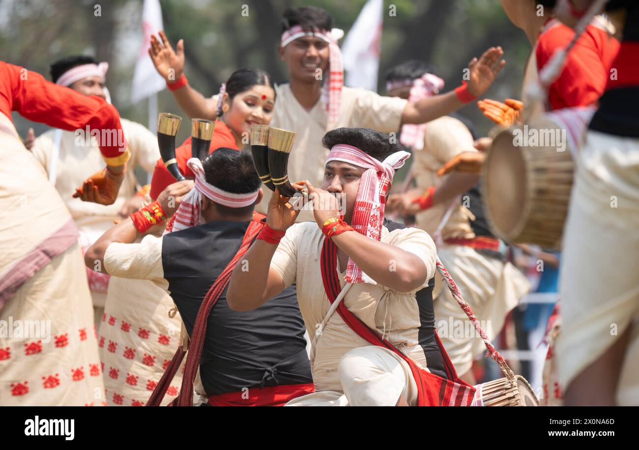 Guwahati, India. 13th Apr, 2024. Young men and women in traditional ...
