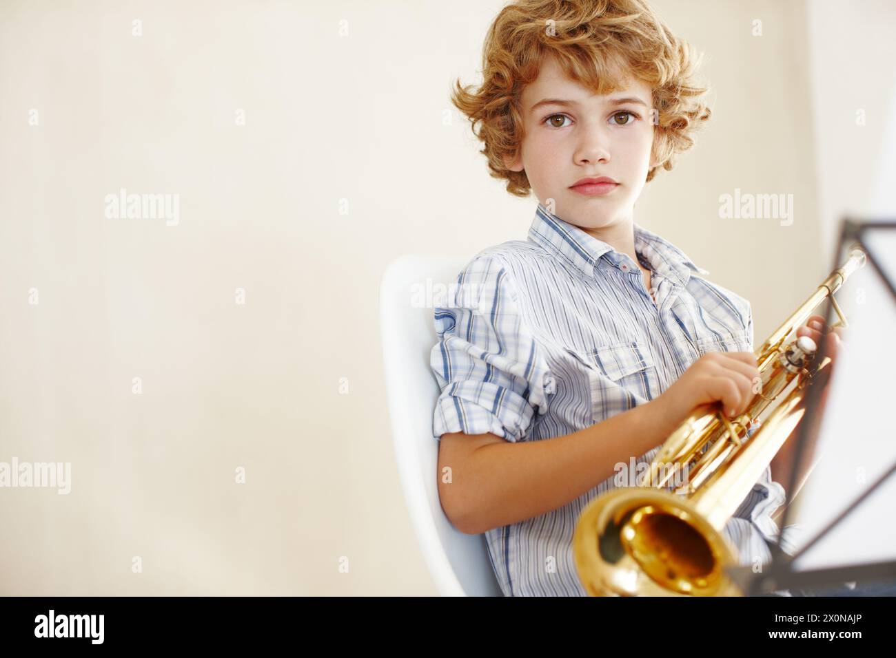 Learning, music and portrait of child with trumpet for skills, lesson ...