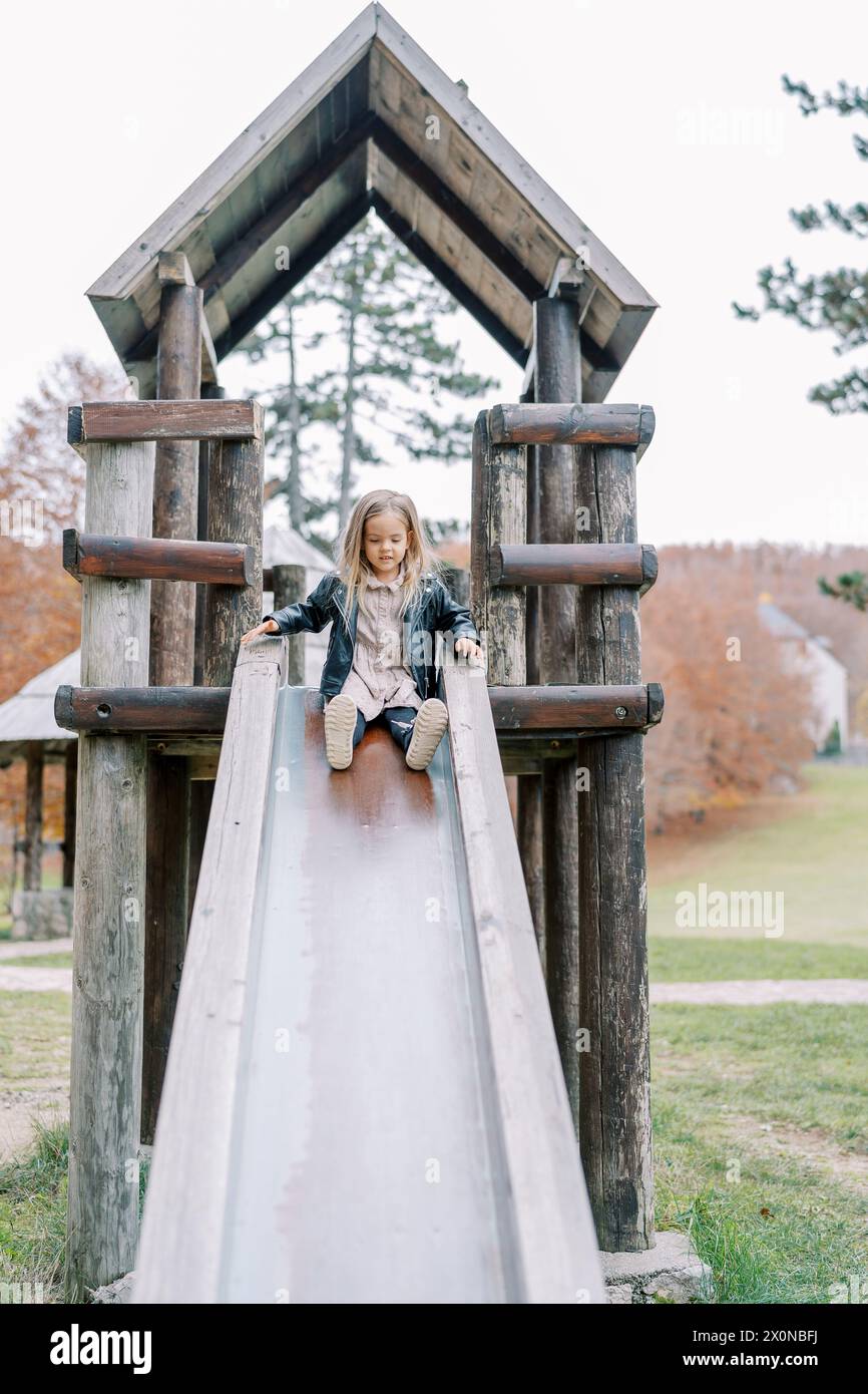 Child going down playground slide hi-res stock photography and images ...