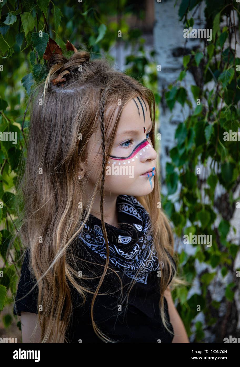 Girl with tribe makeup and hair in the birch tree woods wearing black ...