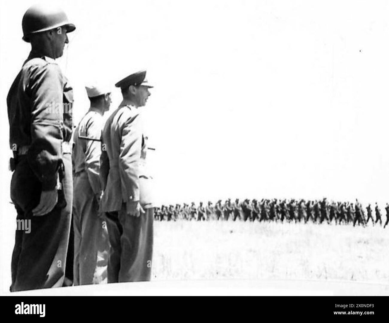 The King inspects and takes the salute during a large-scale march past ...