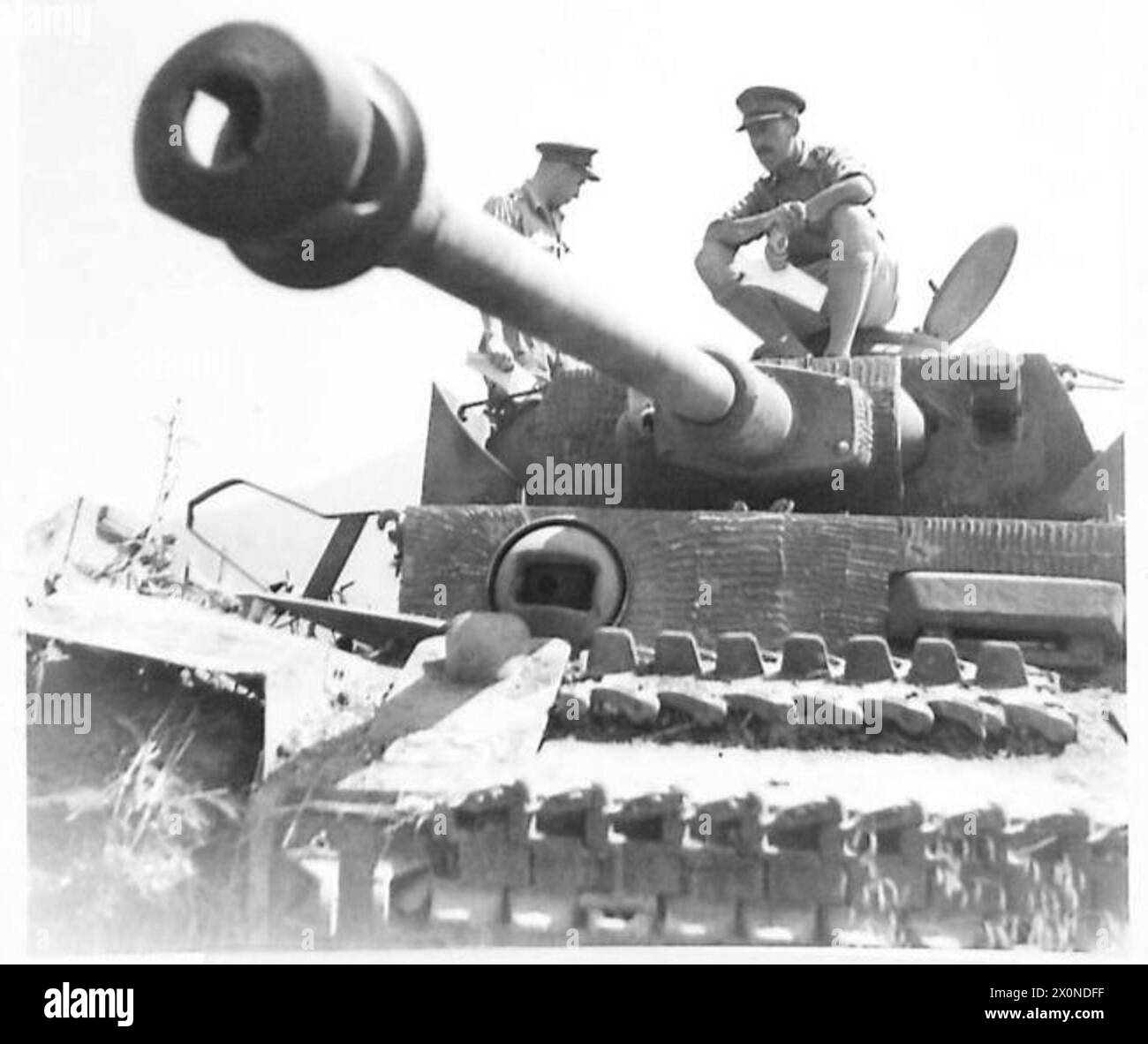 General Leese examines a German Mark IV Special tank, an armored ...