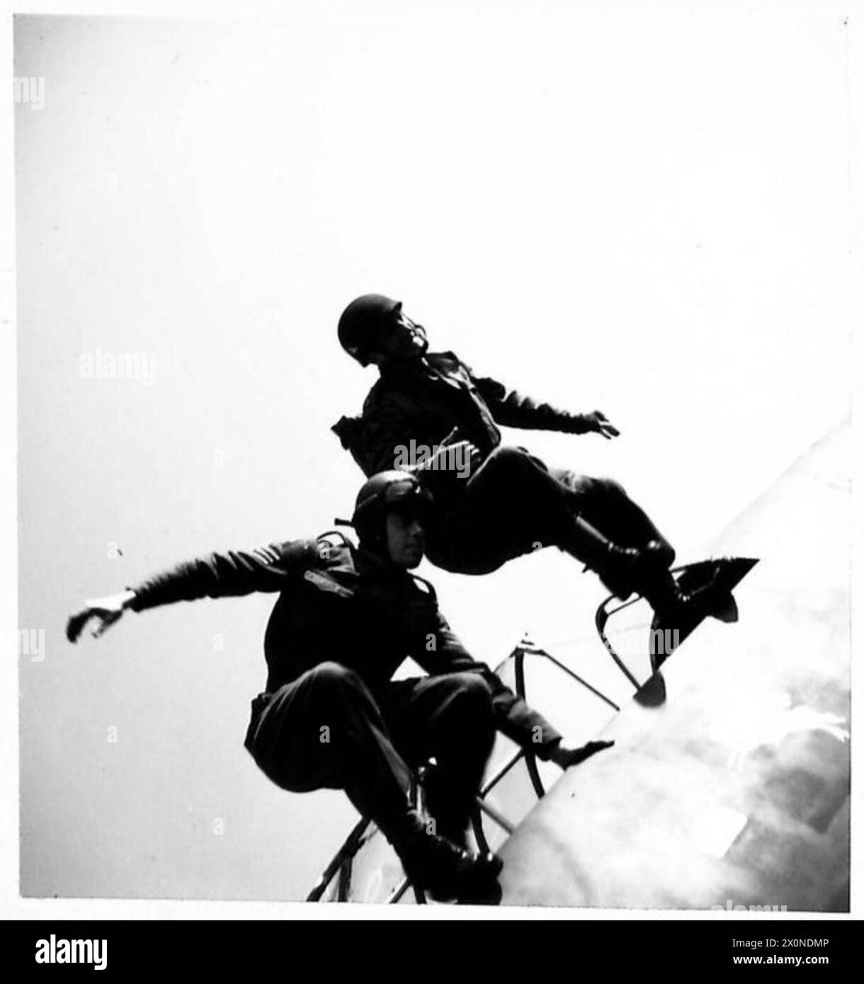 Glider pilot and troop commander deplane during paratroop training ...