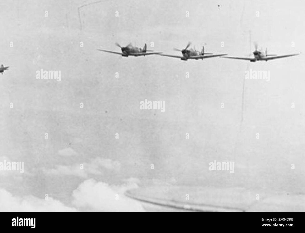 Photographic negative showing Spitfires of No. 610 Squadron RAF flying ...