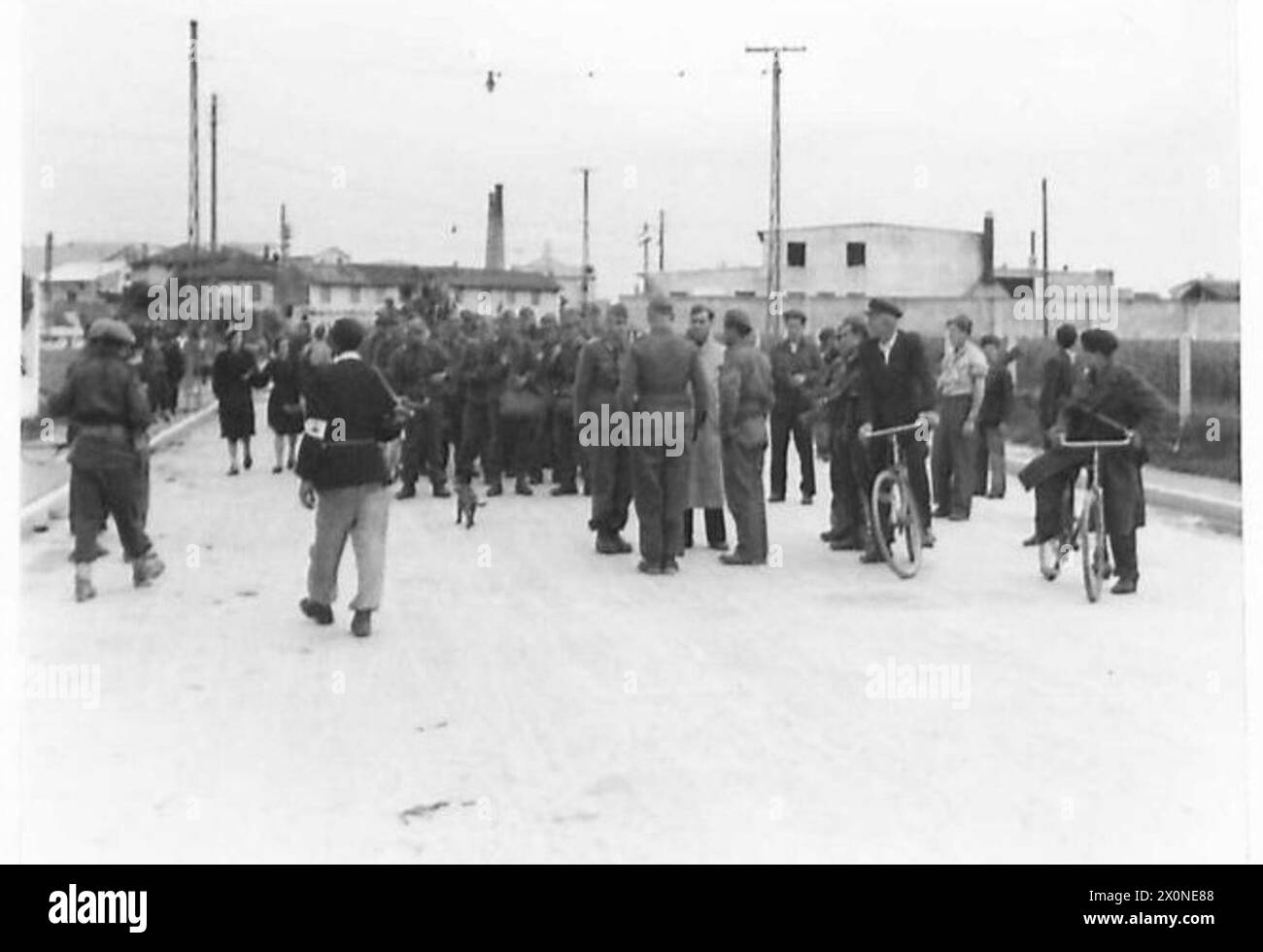 A German column of approximately 300, under Partisan guard, moves along ...