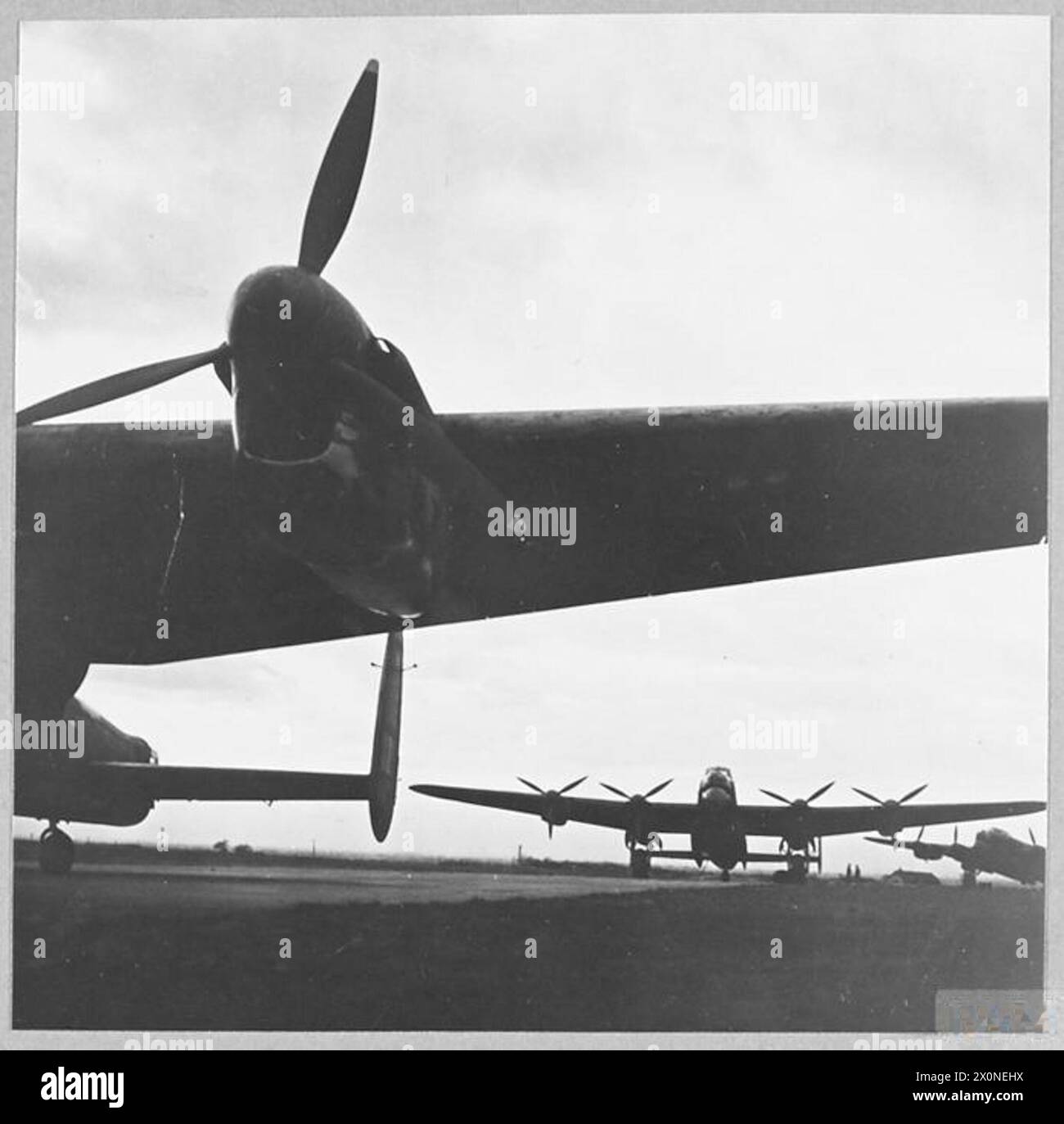 Photograph showing Lancaster bombers marshalling on the airfield and ...