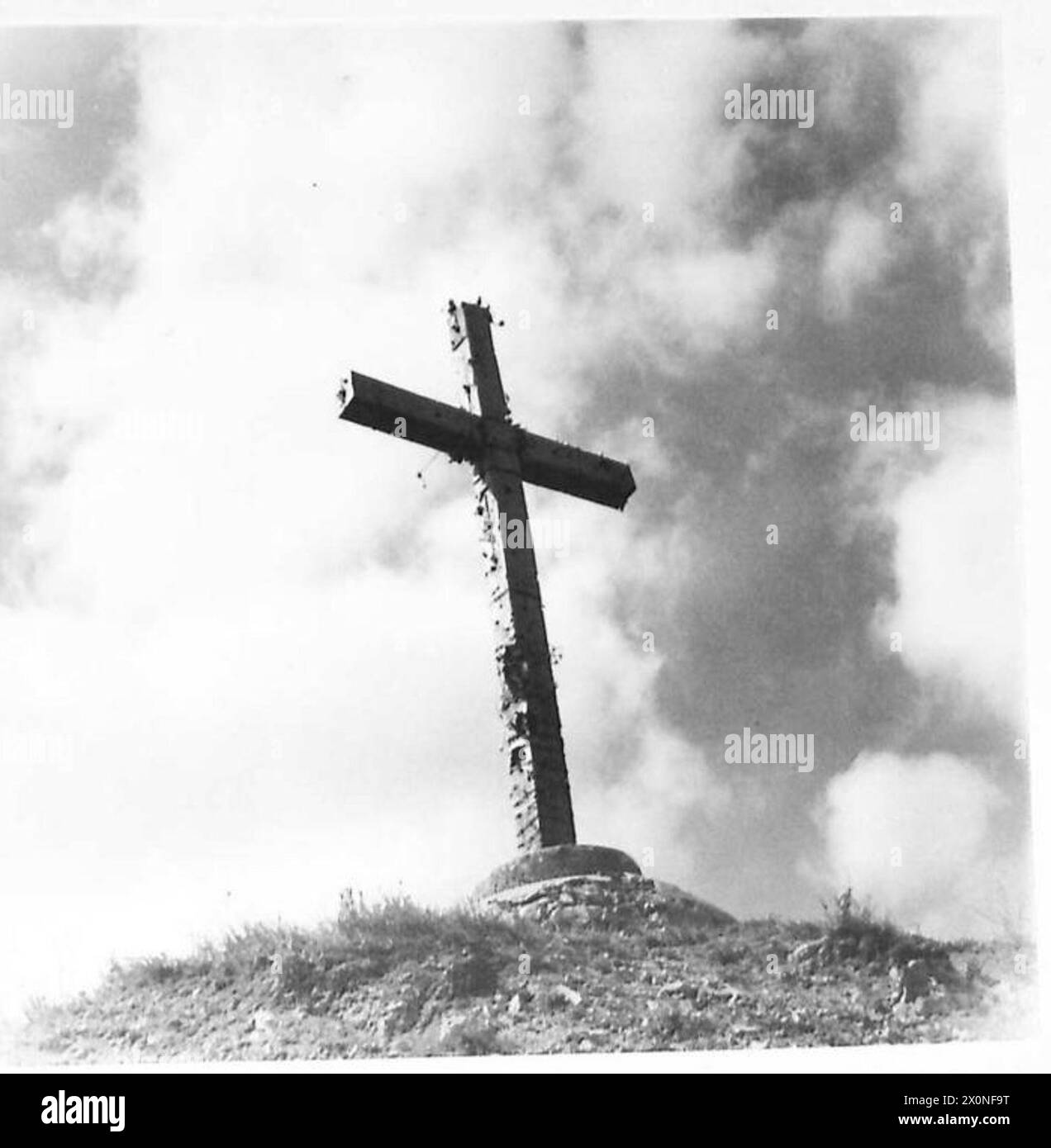 Scots troops of the 8th Army in Zollara are shown near a hilltop cross ...
