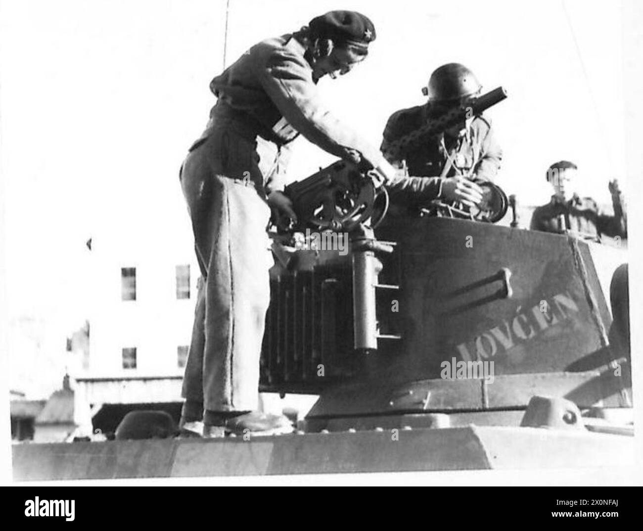 A female Partisan in Yugoslavia operates a Browning machine gun on a ...
