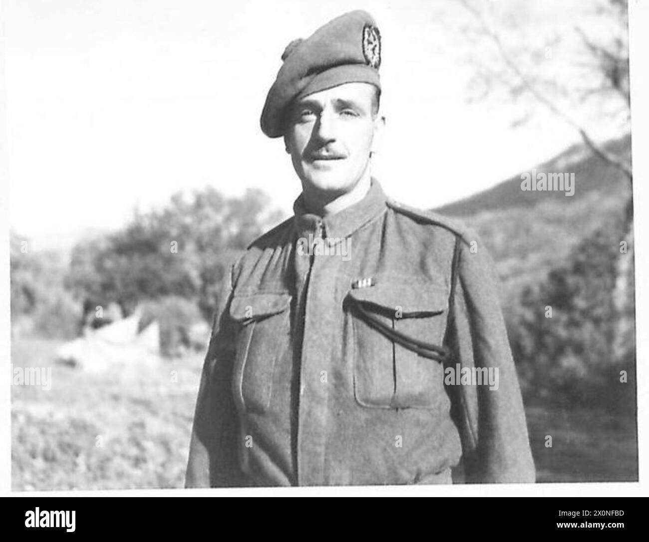 ITALY : EIGHTH ARMY - Sgt. D. Munro of Caryntyne Road, Glasgow, who was ...