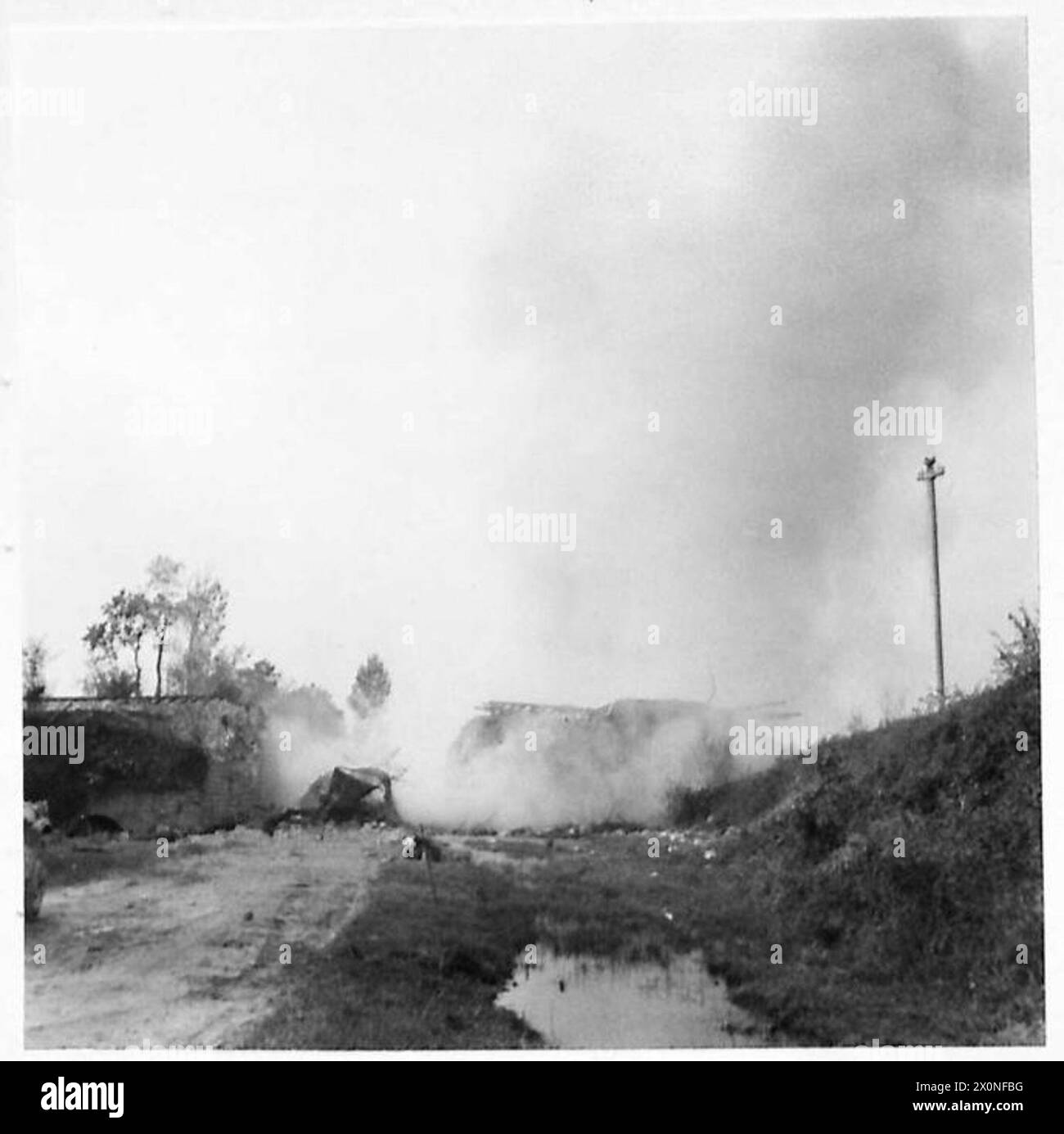 Royal Engineers clear a road obstruction in Italy by placing and ...