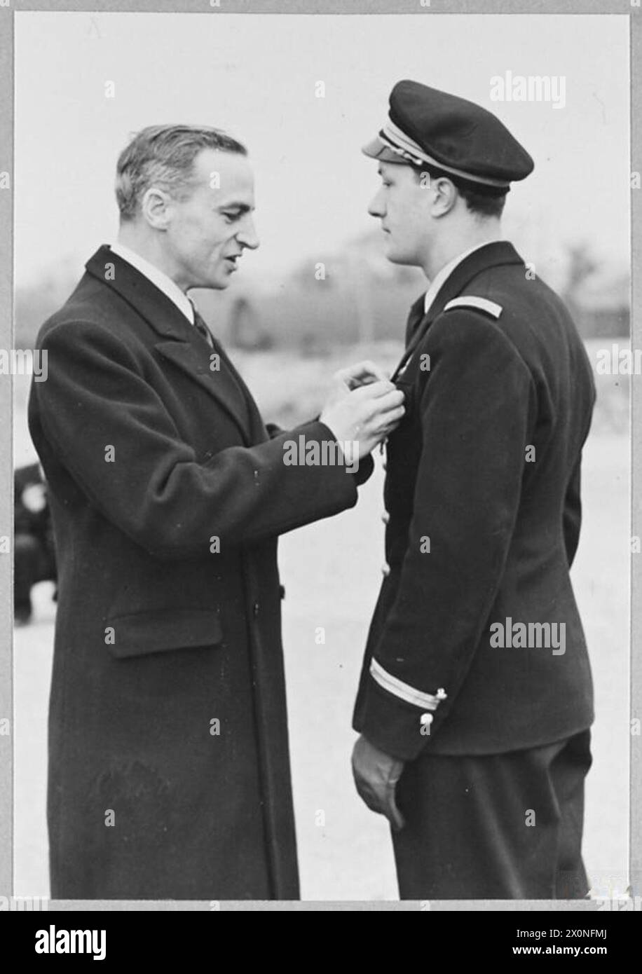 Lieutenant M.A. Rousselot receives the DFC from Sir Archibald Sinclair ...