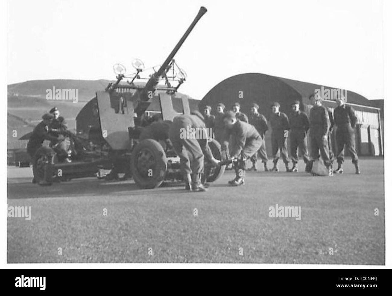 DUTCH TROOPS IN TRAINING - A squad looks on whilst remainder prepare ...